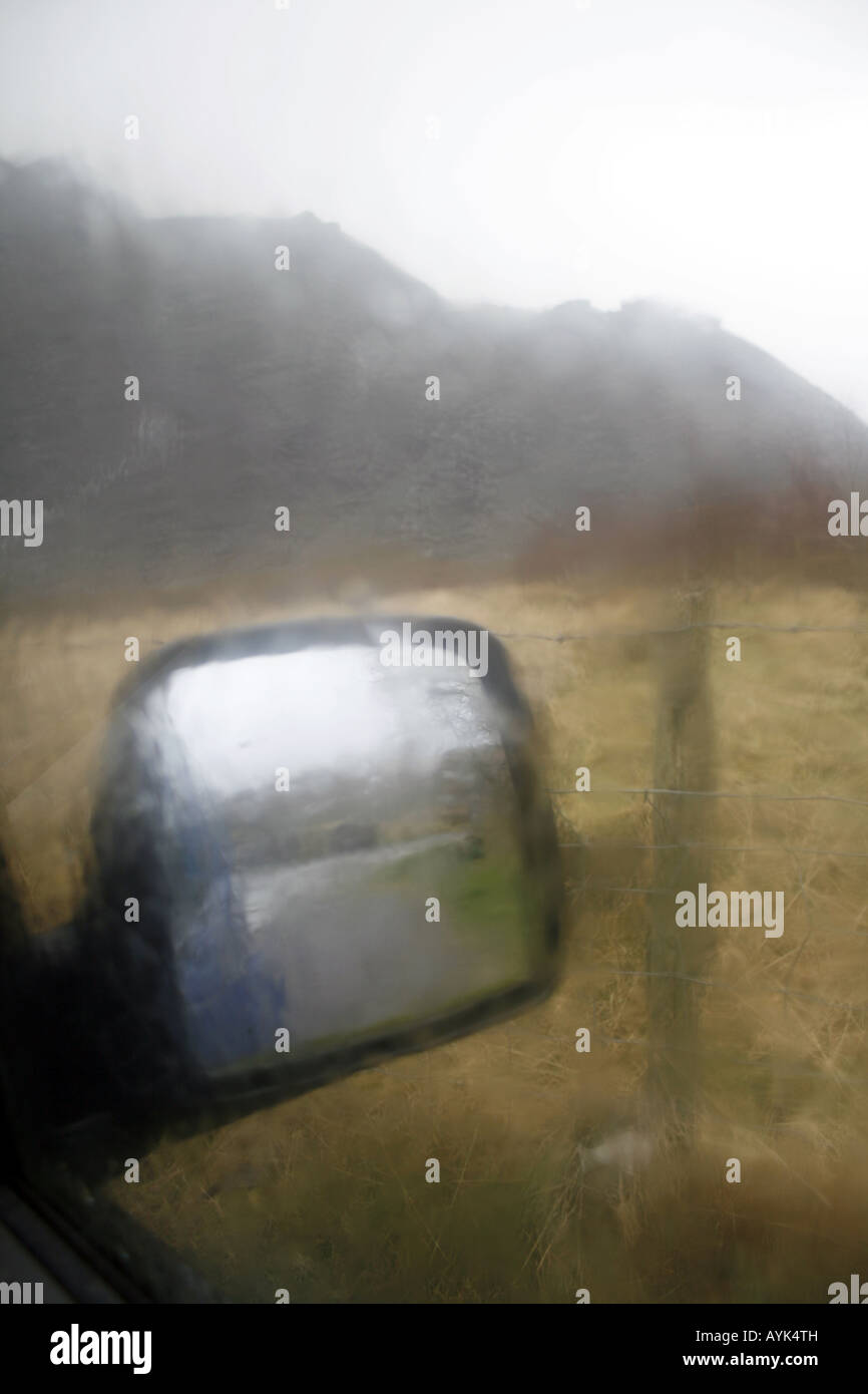 single car wing mirror in rainy landscape Stock Photo - Alamy