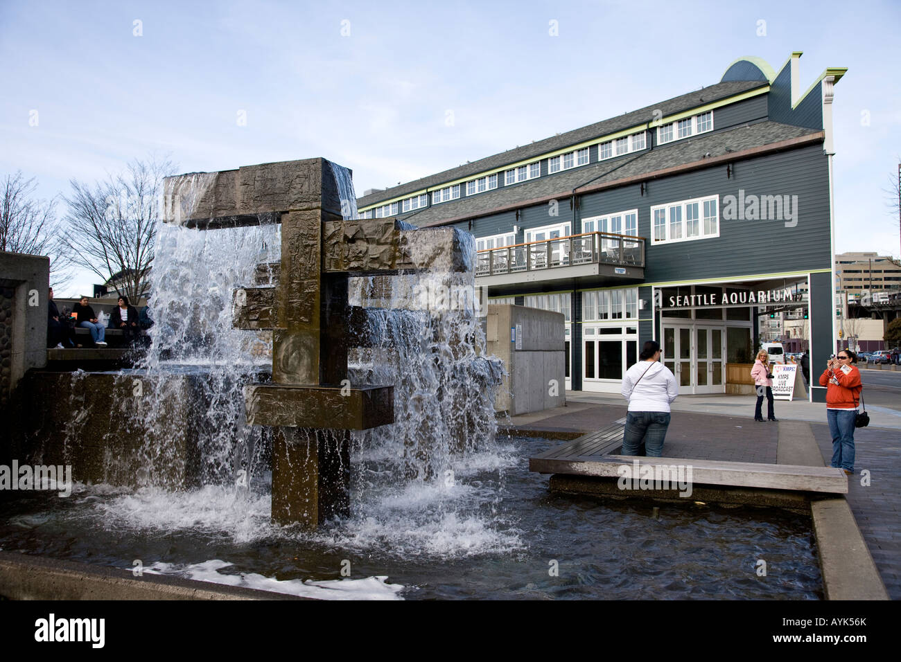 People by the fountain in front of Seattle Aquarium on Elliott Bay ...