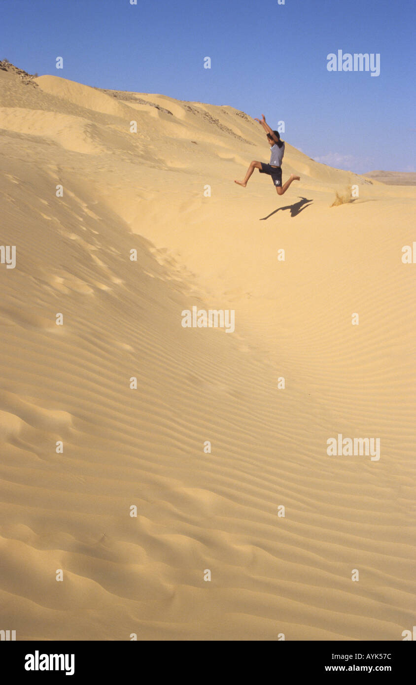 Jumping Boy Sand 1 Stock Photo - Alamy