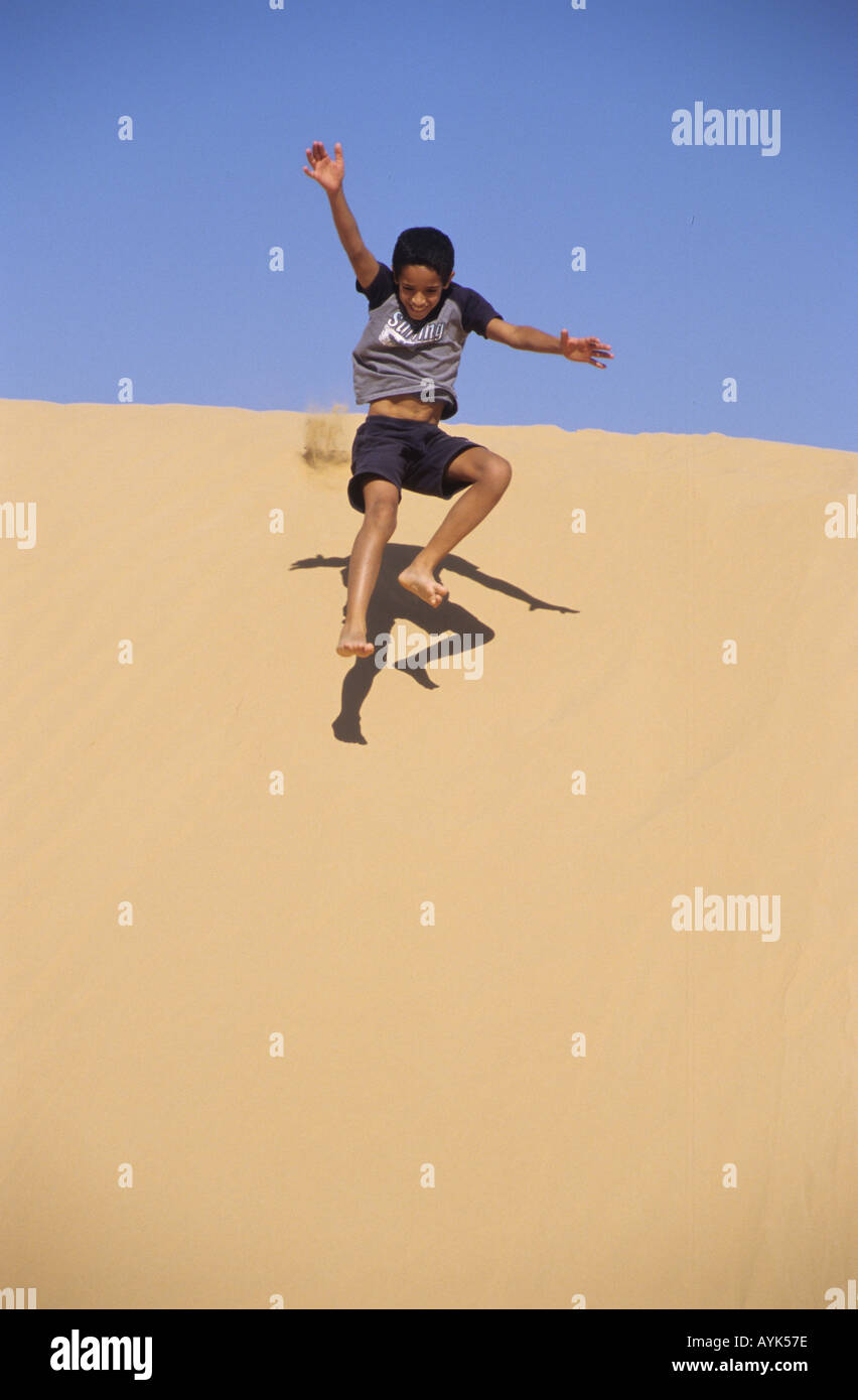 Jumping Boy Sand 2 Stock Photo - Alamy