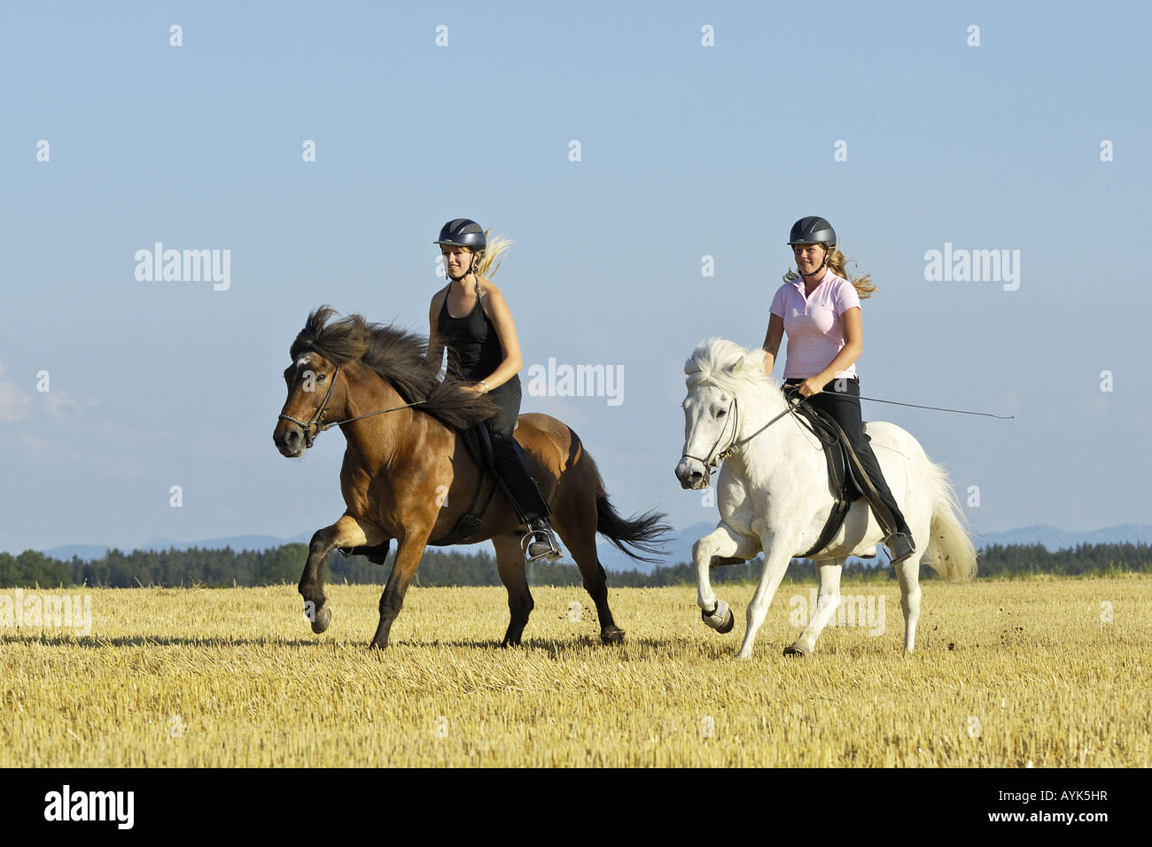 Two young women riding ponies hi-res stock photography and images - Alamy