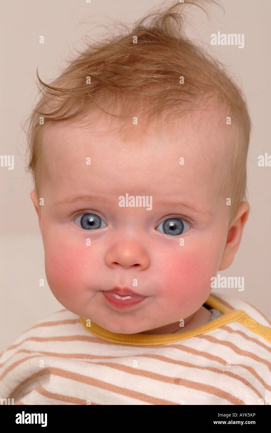 Cute portrait of a rosy cheeked baby boy Stock Photo - Alamy
