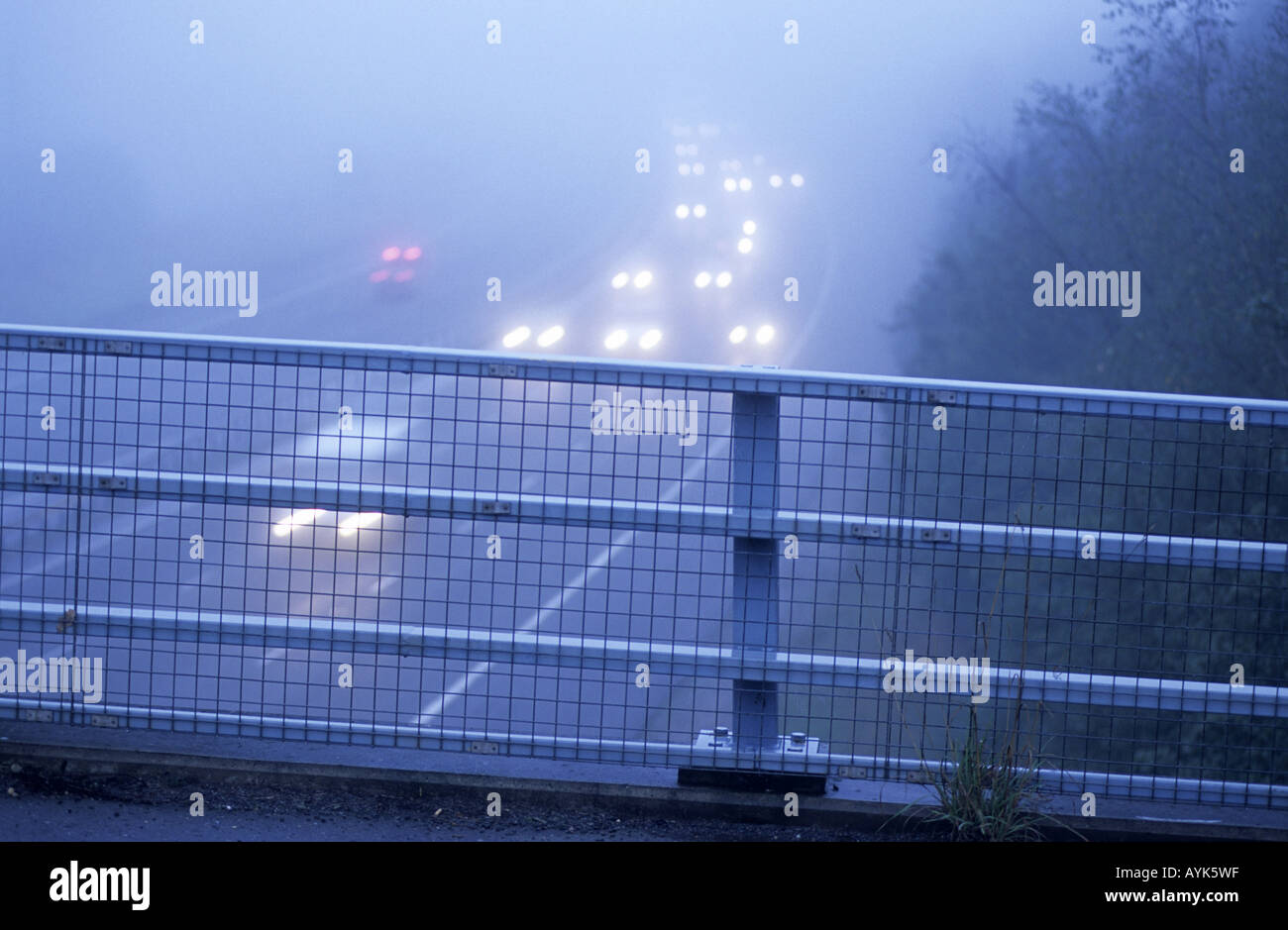 M40 motorway in fog seen from overbridge, Warwickshire, England, UK ...