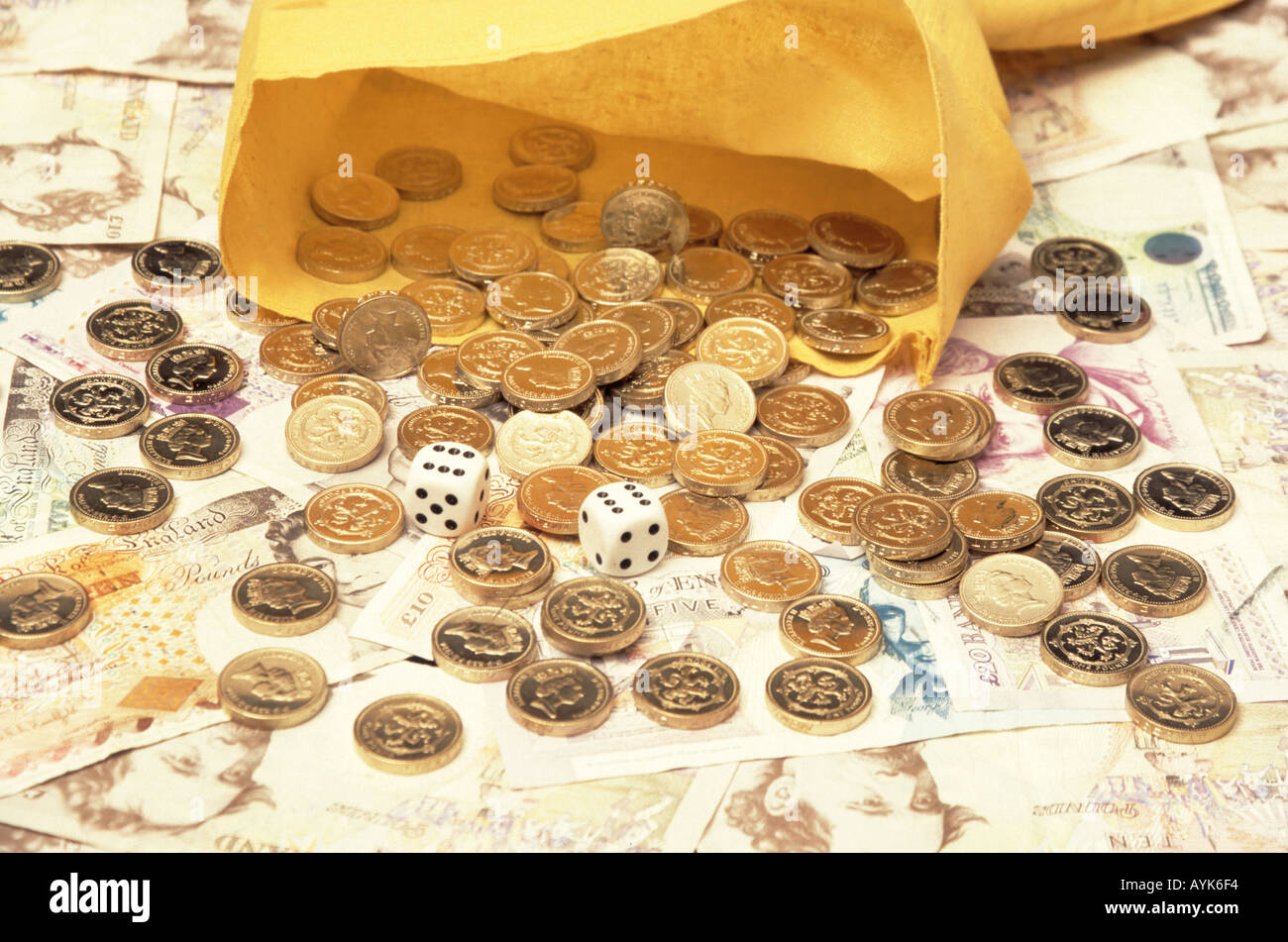 One pound coins & bank money bag with bank notes includes dice for ...
