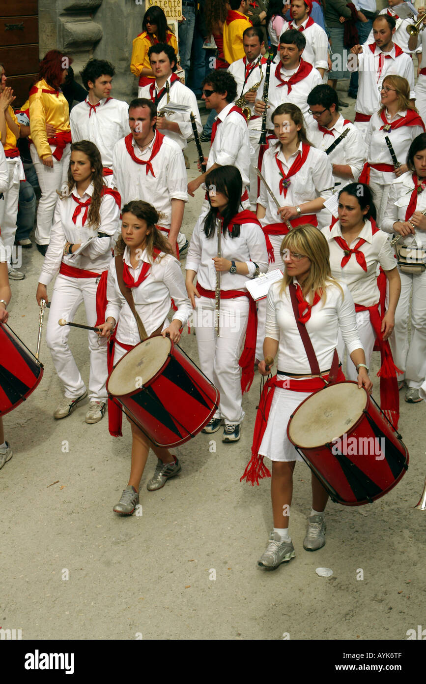 band of girls playing the drums during a religious procession part of ...