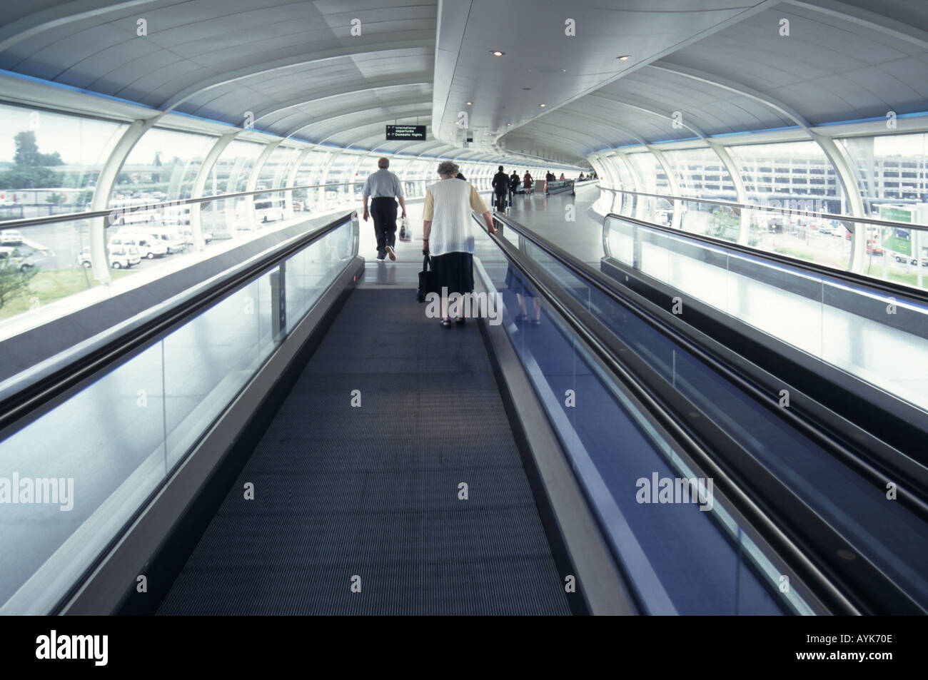 Airport passengers using travelator Stock Photo - Alamy