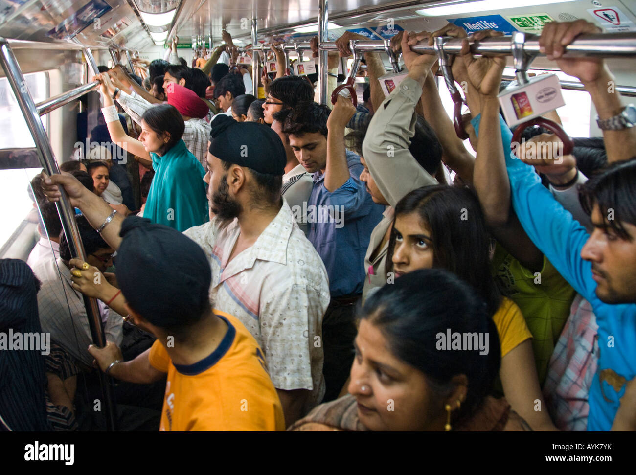 Passengers inside a carriage on the Delhi Metro in India Stock Photo ...