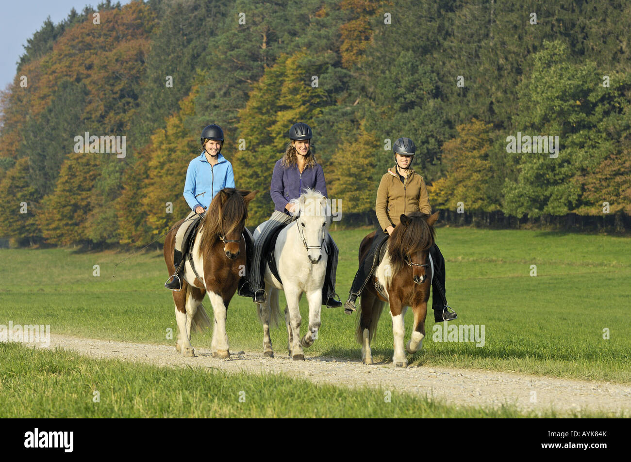 three girls riding Stock Photo - Alamy