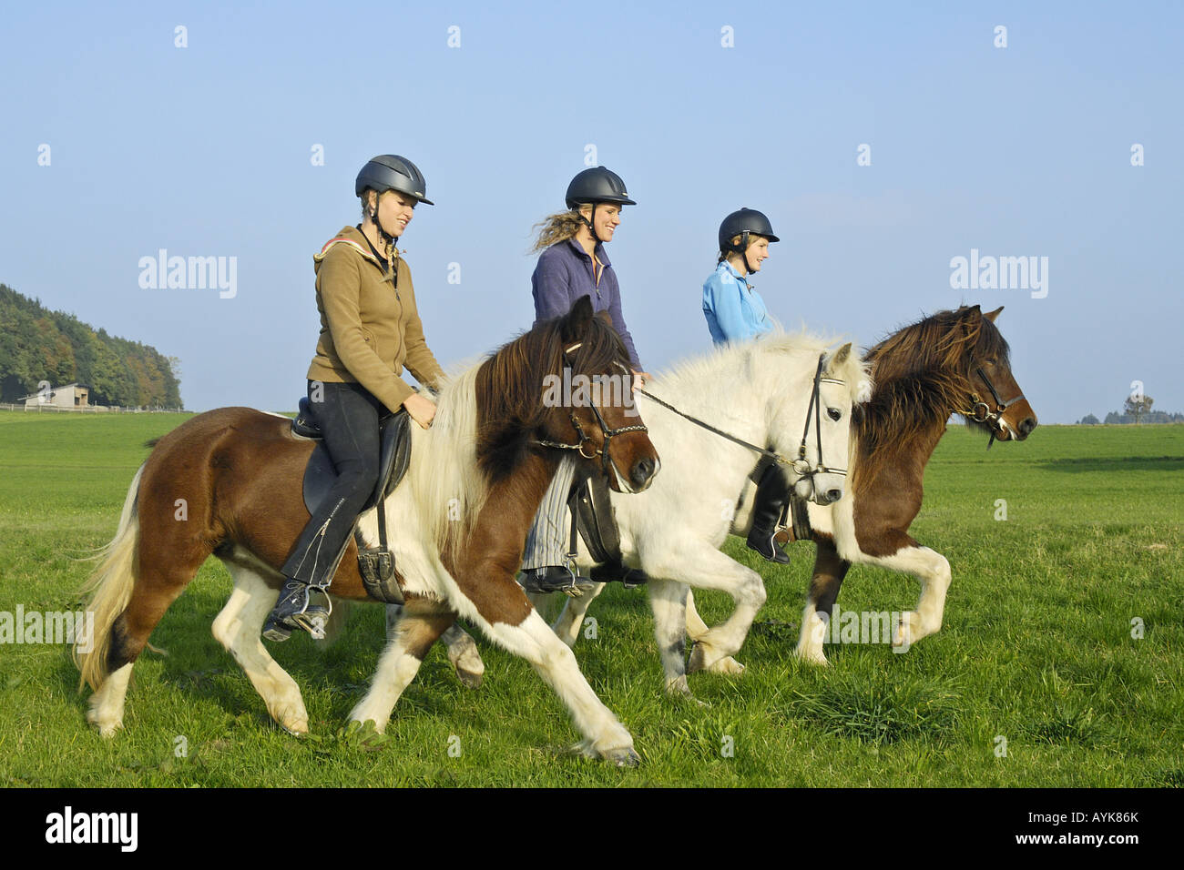 three girls riding Stock Photo - Alamy