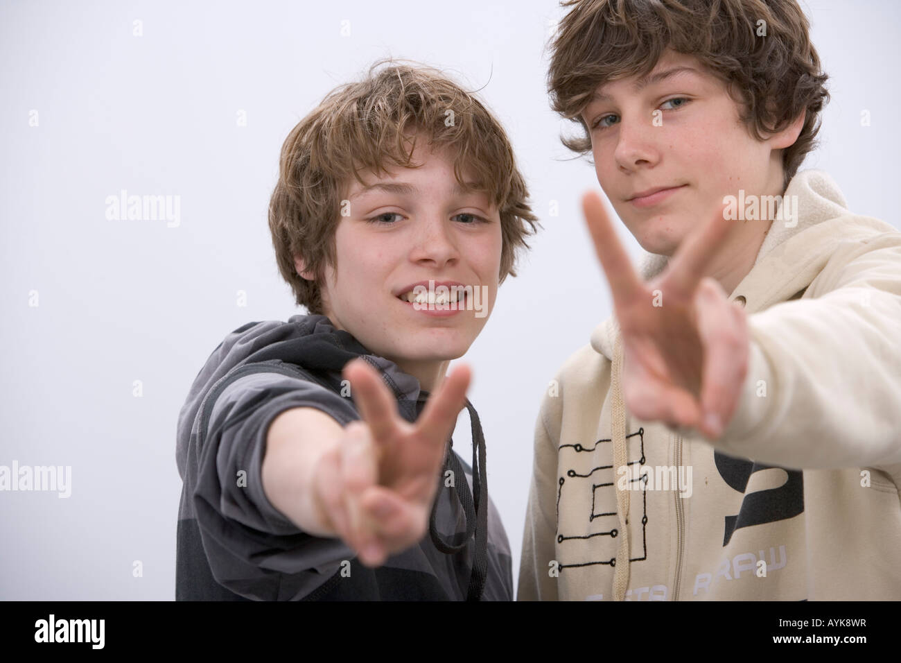 Two teenage boys making fun Stock Photo - Alamy