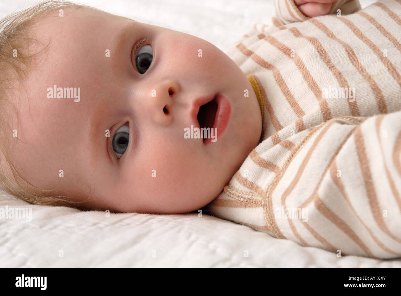 Portrait of a baby boy looking surprised Stock Photo - Alamy
