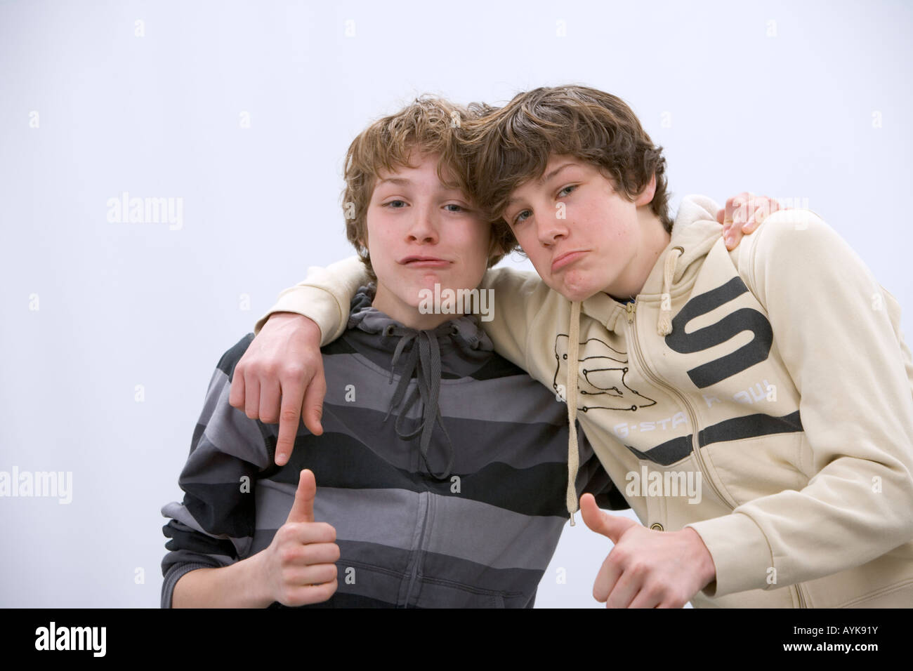 Two teenage boys making fun Stock Photo - Alamy