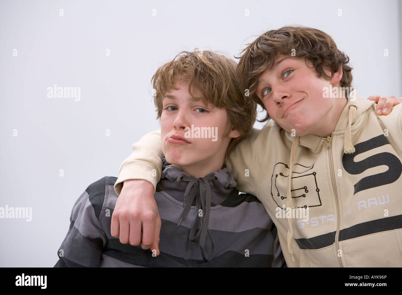 Two teenage boys making fun Stock Photo - Alamy