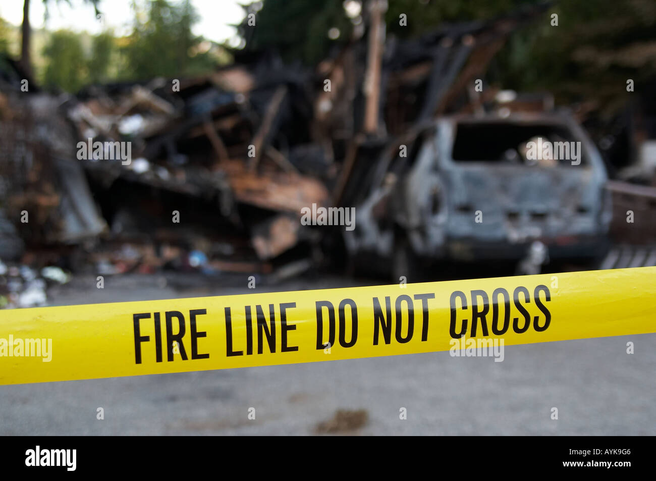 Fire do not cross sign, barring entry to burnt down house Stock Photo ...