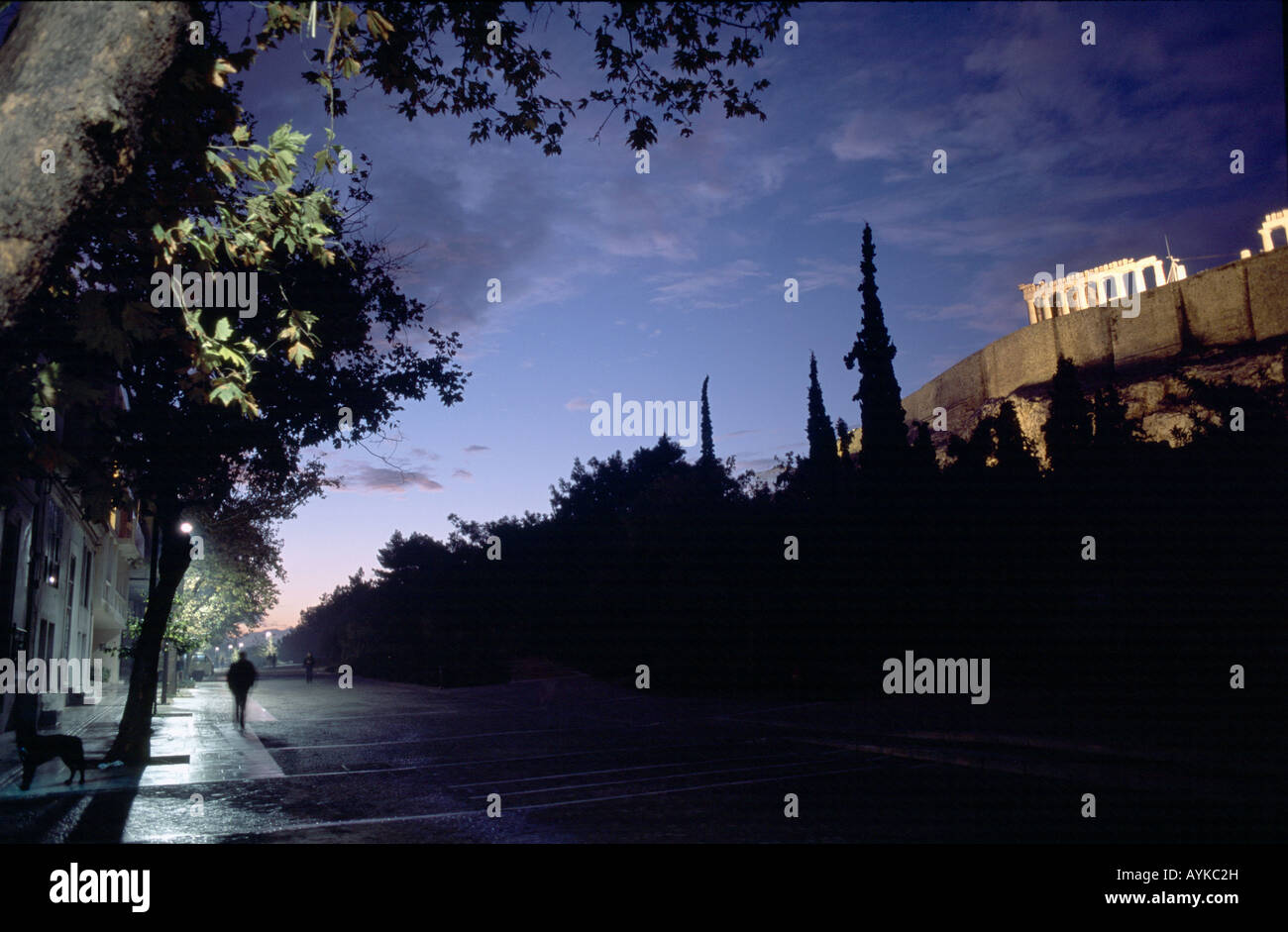 The Parthenon is floodlit seen from Dyonisiou Areopagitou climbing to ...