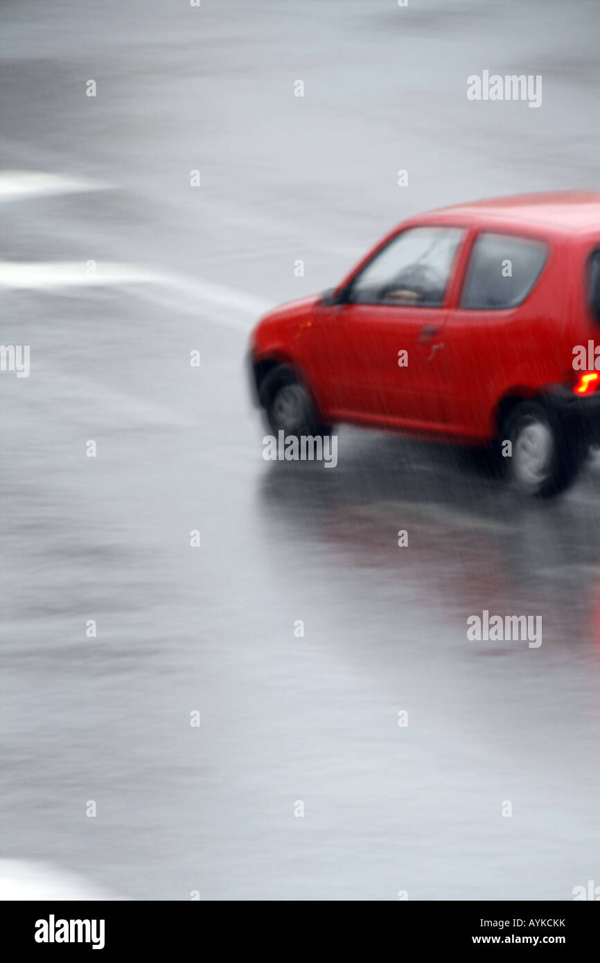 one abstract blurred fast car in rain Stock Photo - Alamy