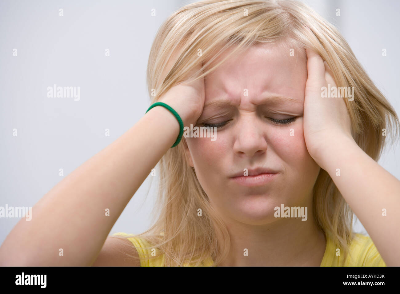Teenage girl with a headache Stock Photo - Alamy