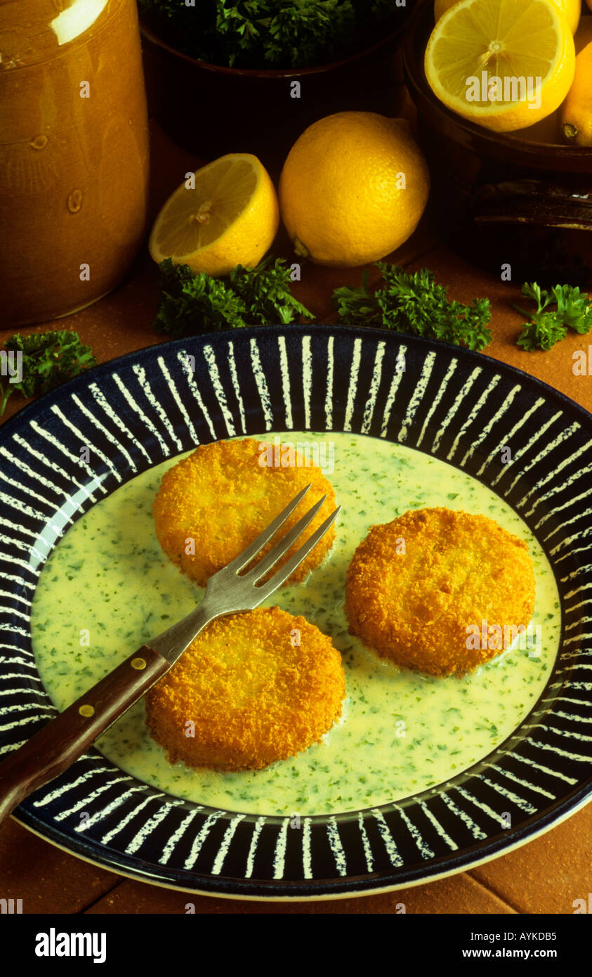 Fish cakes and parsley sauce Traditional British Food Stock Photo - Alamy