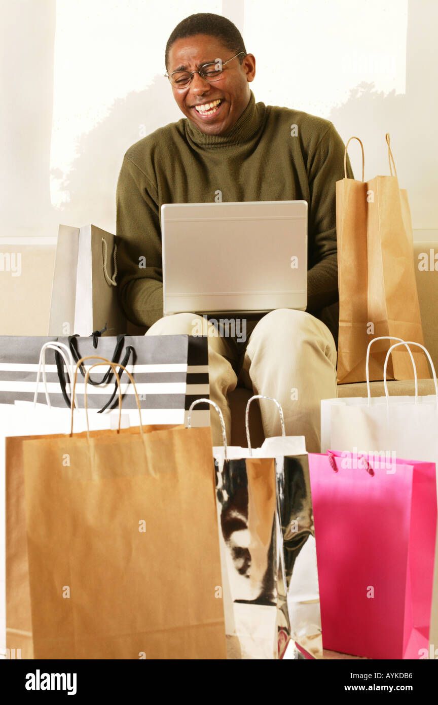 man shopping online with laptop Stock Photo - Alamy