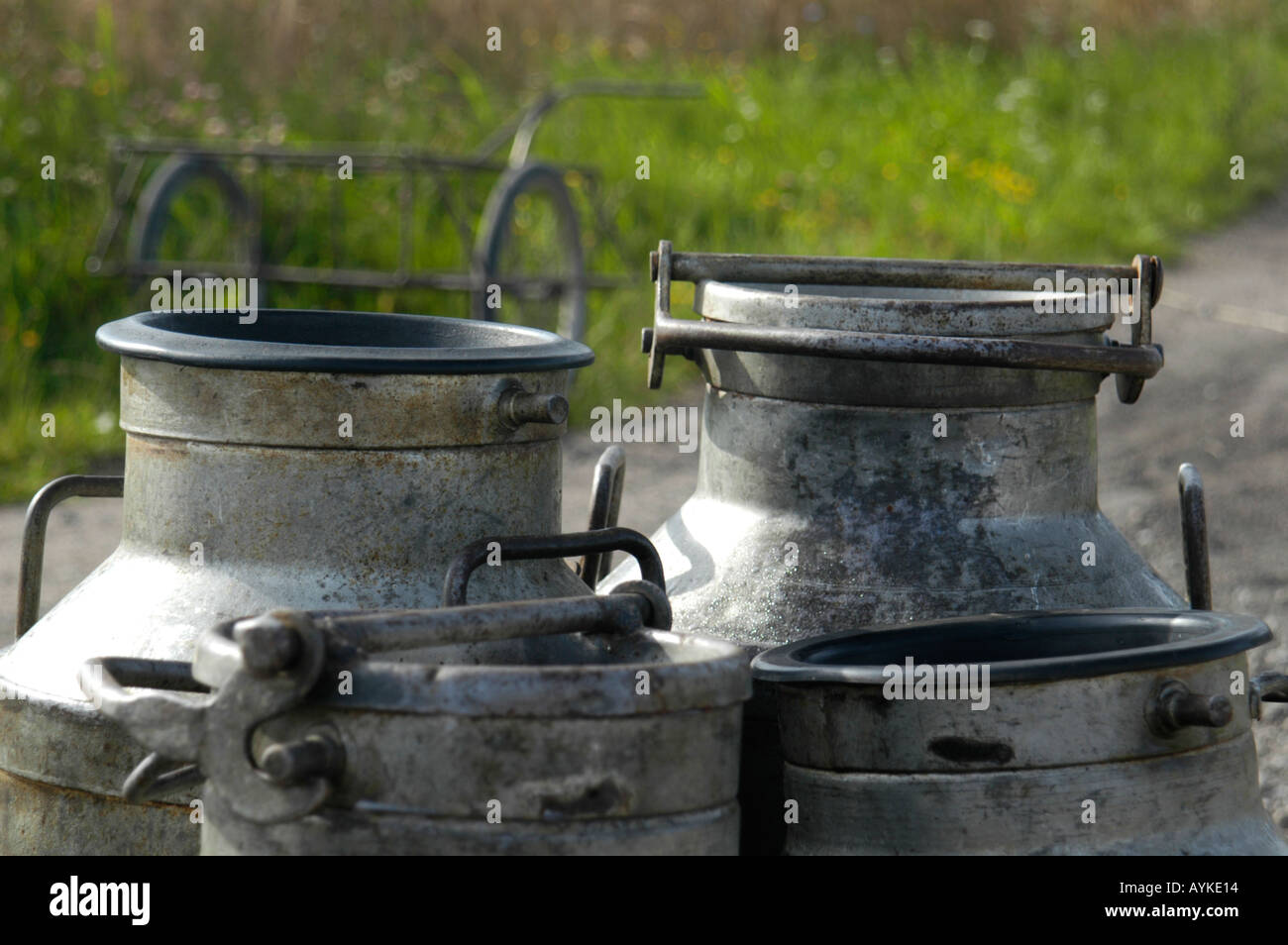 Old fashioned milk churns hi-res stock photography and images - Alamy