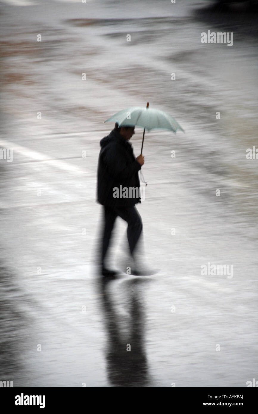Man Walking In The Rain