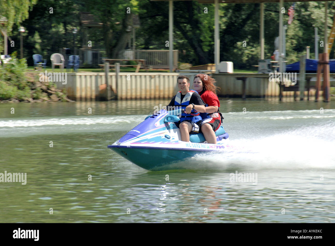 Two people on jetski hi-res stock photography and images - Alamy