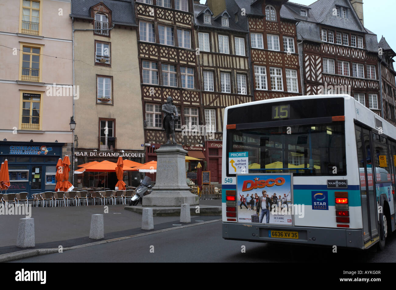 Medieval mediaeval houses in Place du Champ Jacquet with statue of ...
