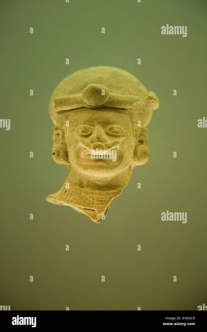 Statue head in the gold museum in Bogota Stock Photo - Alamy