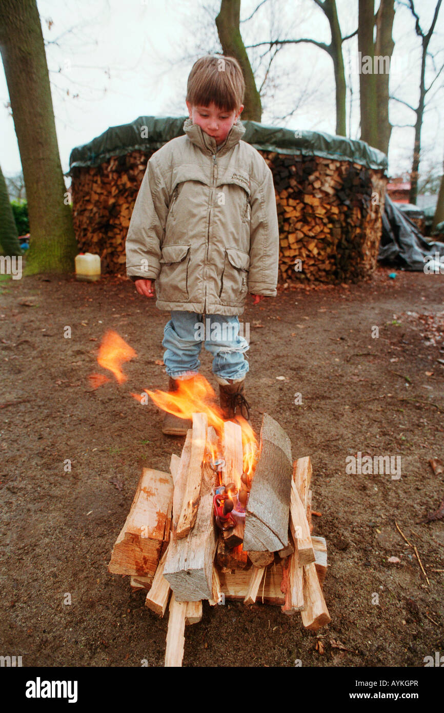 Boy symbolically burning his dummies Stock Photo - Alamy
