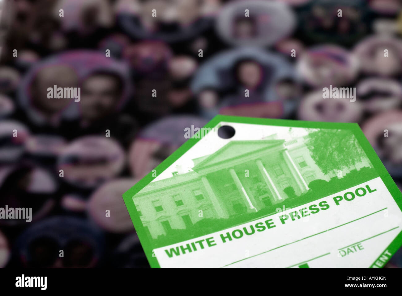 A White House Press Pass is seen with a backdrop of political buttons ...