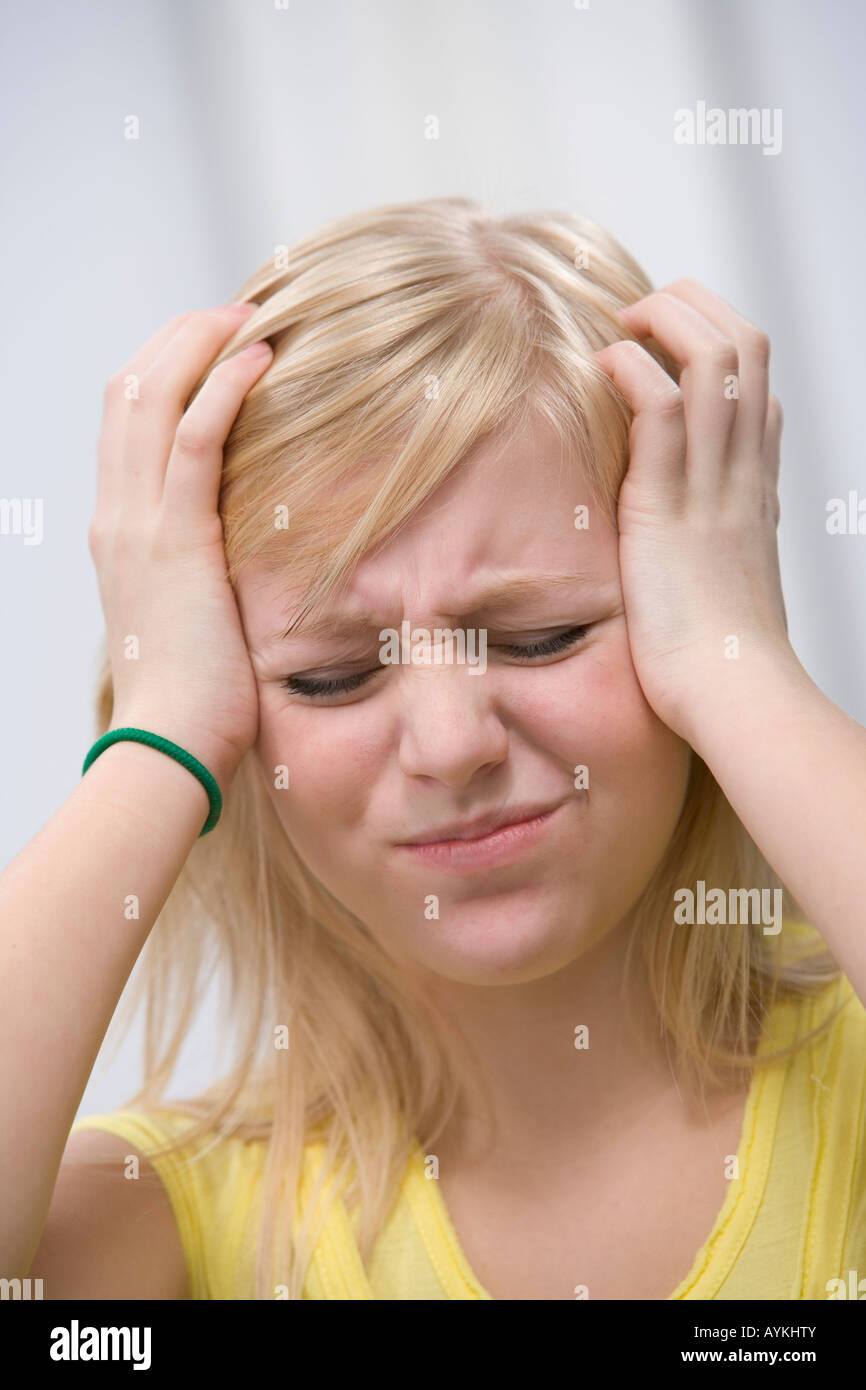 Teenage girl with a headache Stock Photo - Alamy