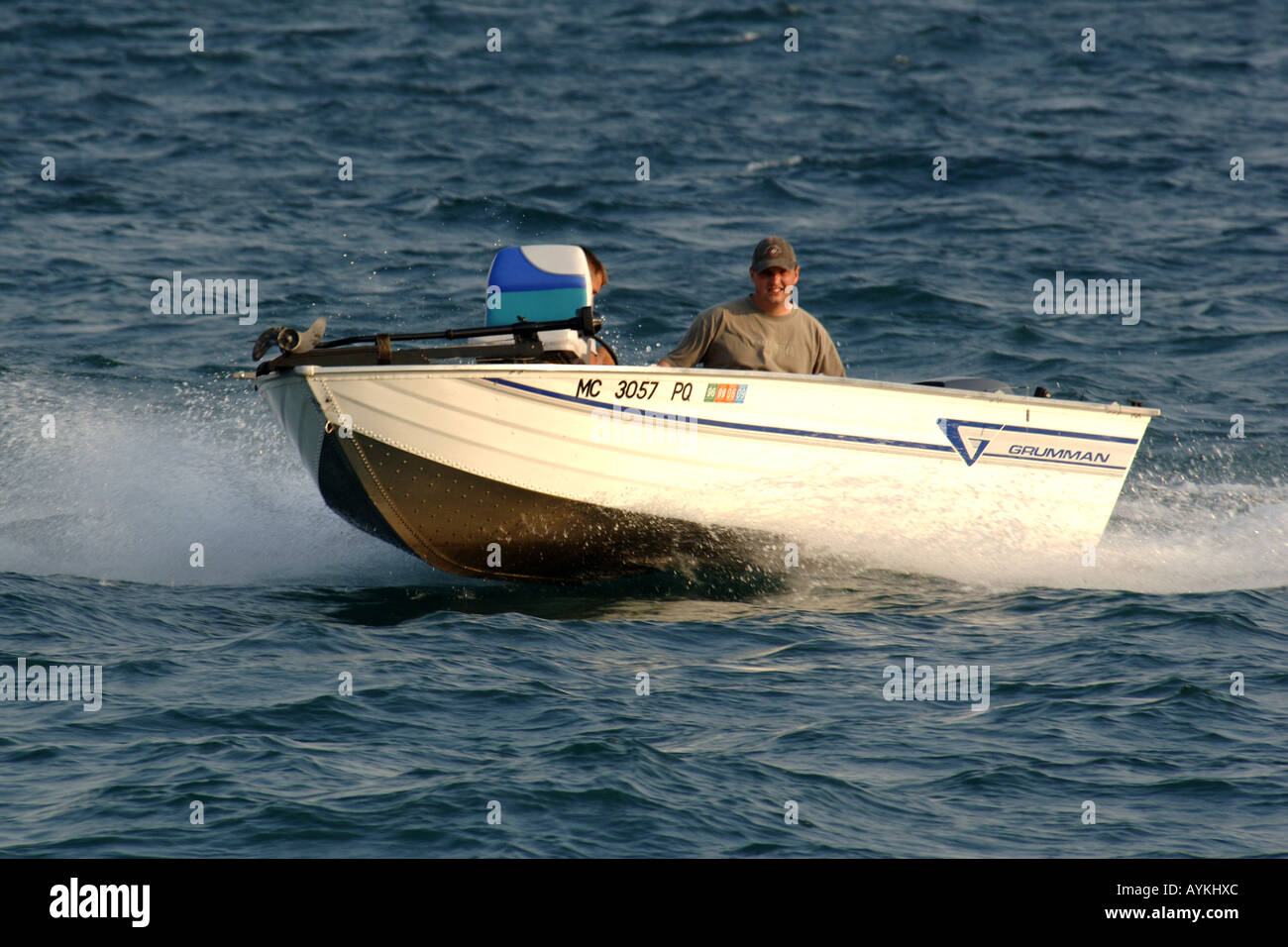 Small two man fishing boat with an outboard motor on the St Clair River ...