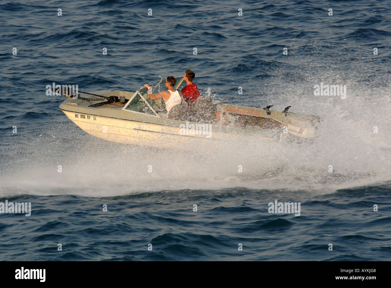Small two man fishing boat with an outboard motor on the St Clair River ...