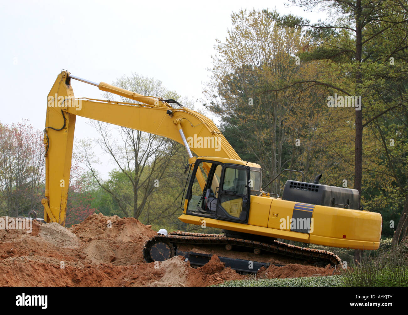 A front end loader atop a pile of dirt Stock Photo - Alamy