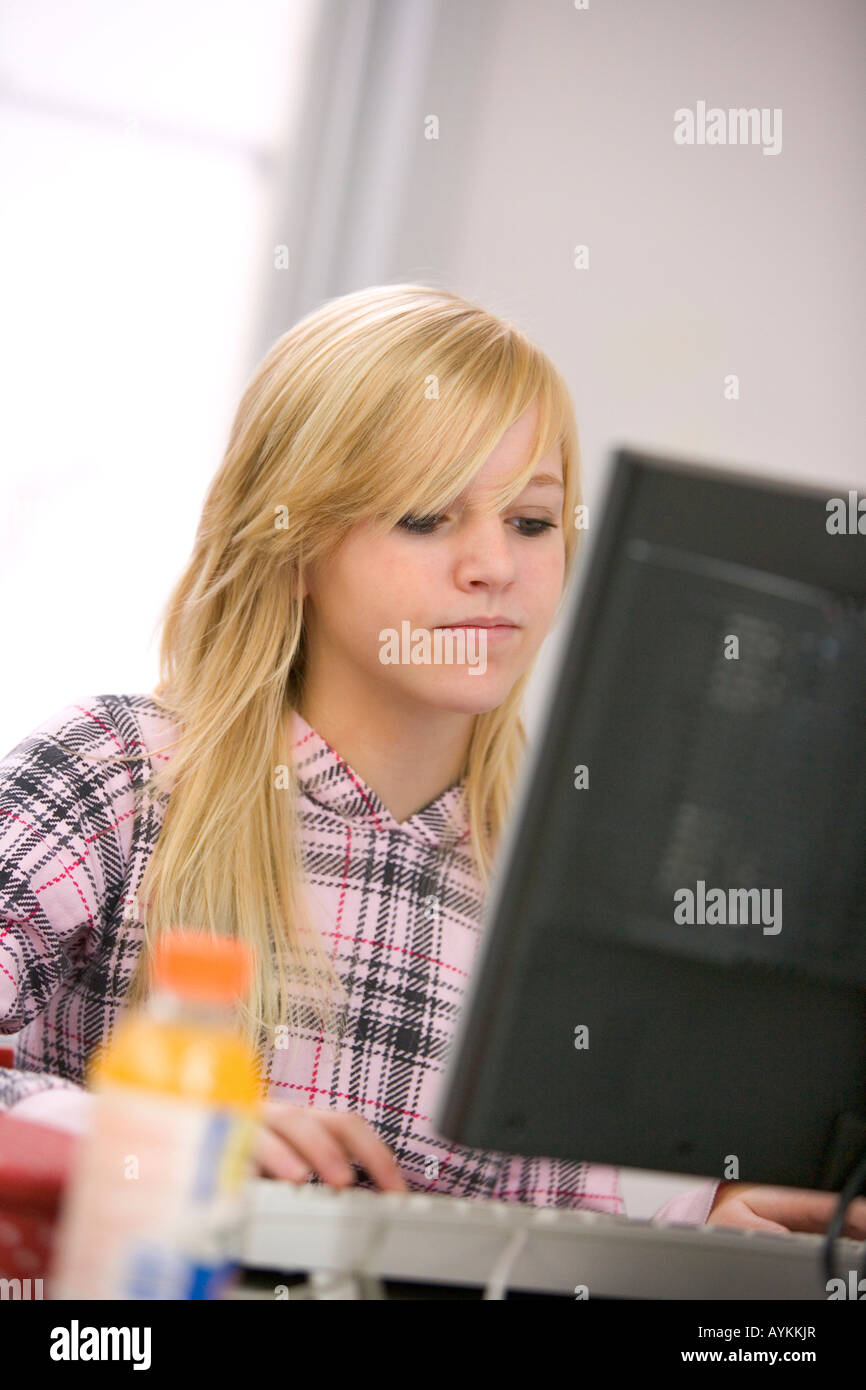 Teenage girl behind a computer Stock Photo - Alamy