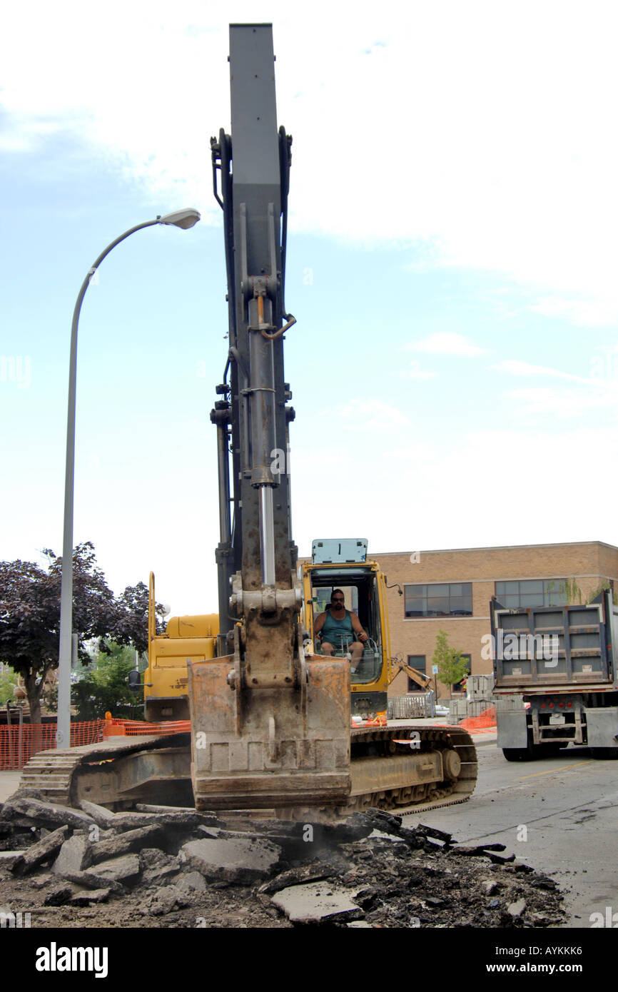 Excavator digging up pavement hi-res stock photography and images - Alamy