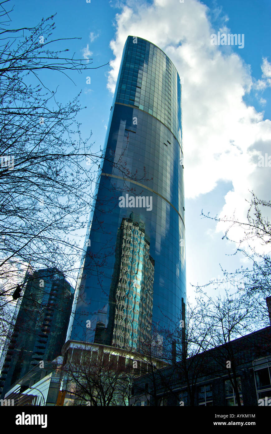 The former BC Hydro building reflected in the windows of the Sheraton ...