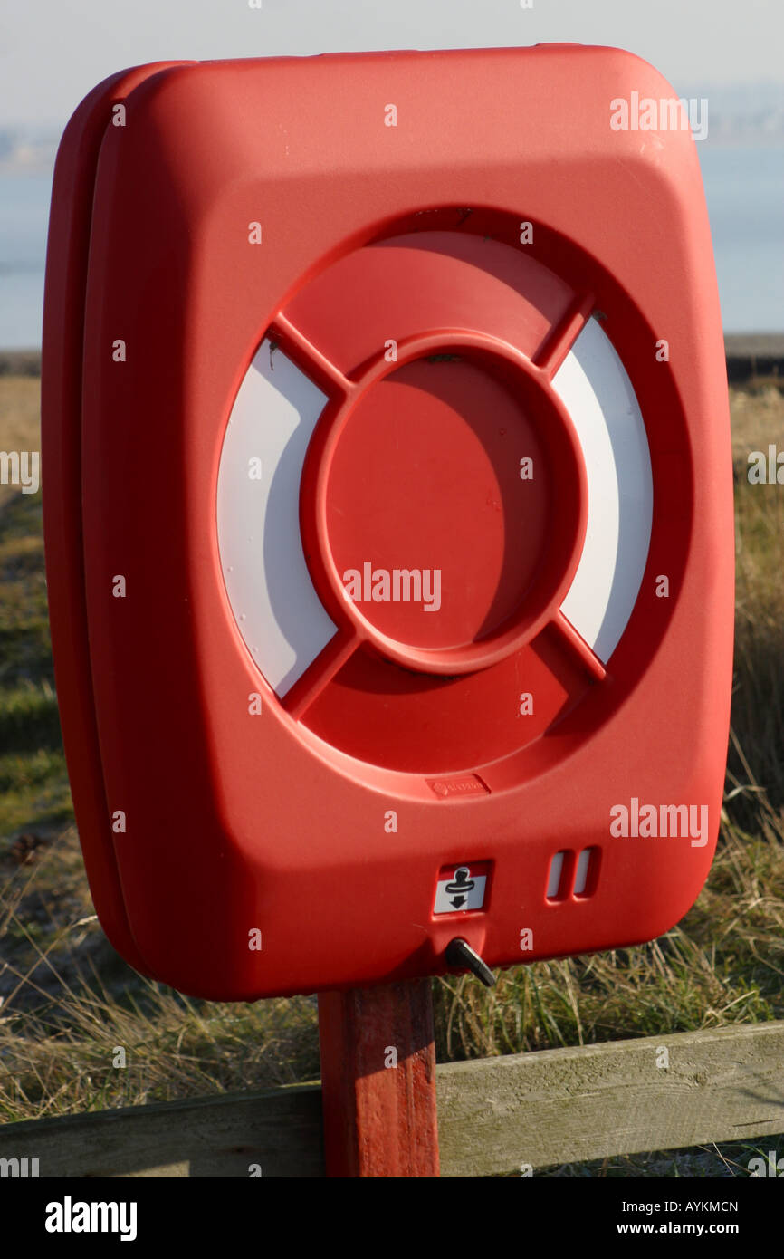 red life buoy holder post saver help rescue swim Stock Photo - Alamy
