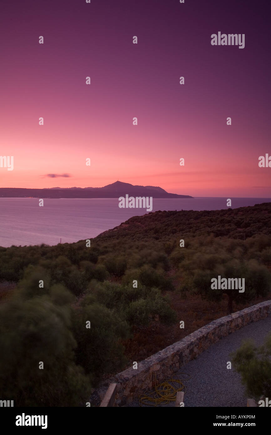 Purple Sunset over Crete sandy beach Stock Photo - Alamy