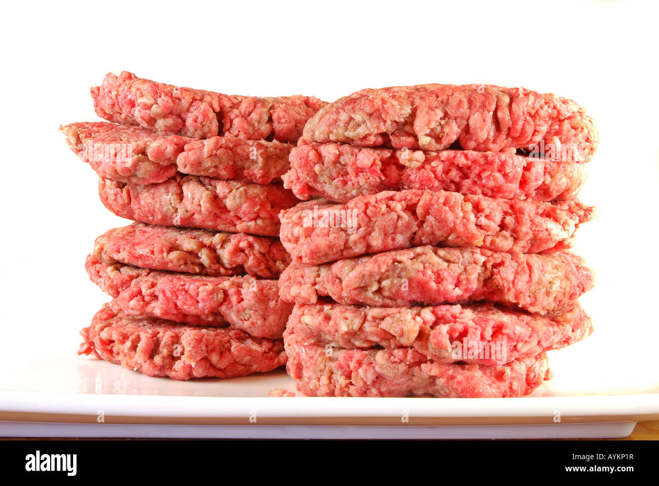 Stacks of uncooked hamburger patties Stock Photo - Alamy