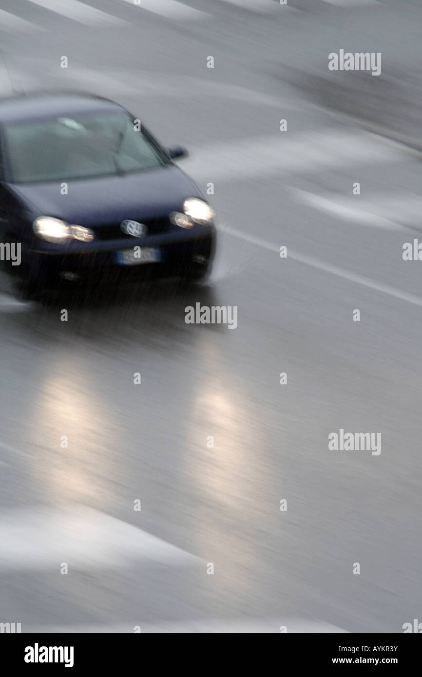 one abstract blurred fast car in rain Stock Photo - Alamy