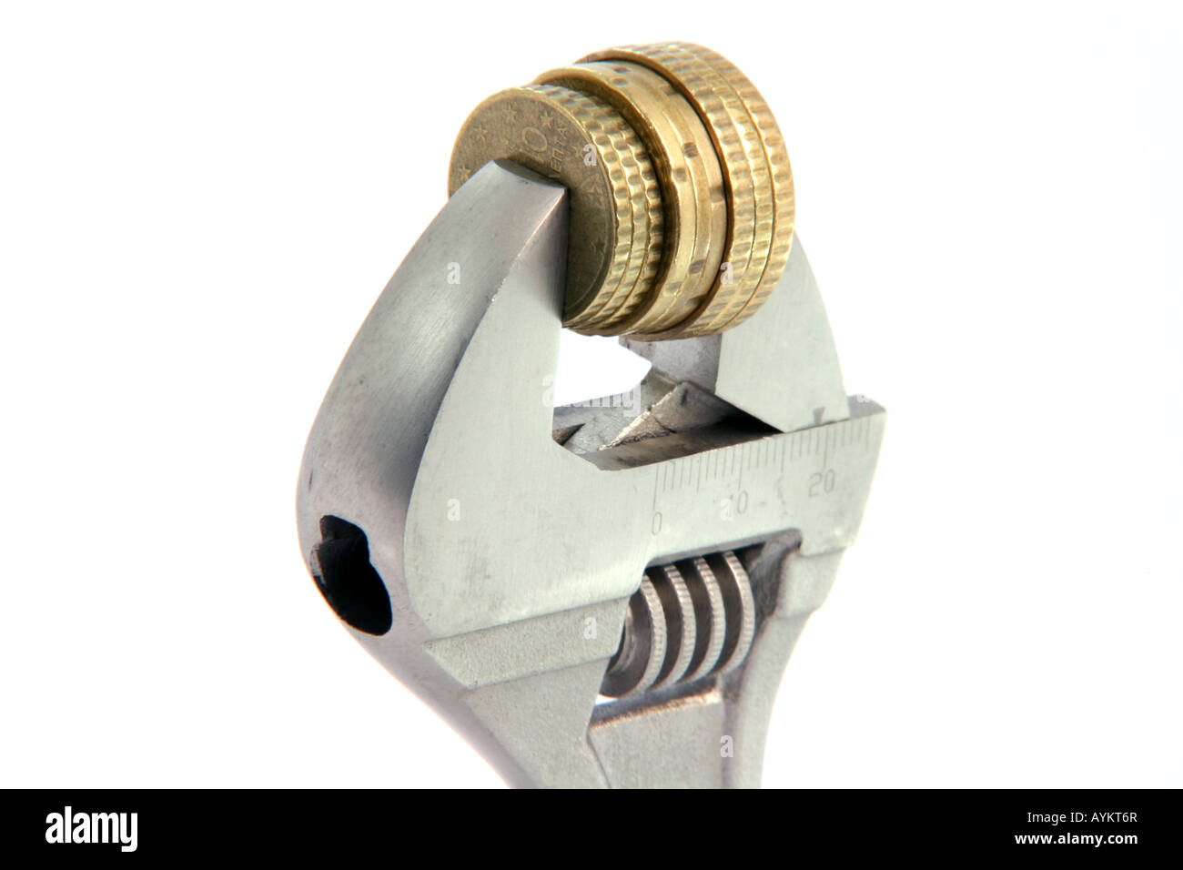 wrench and coins isolated on white background industrial tools and ...