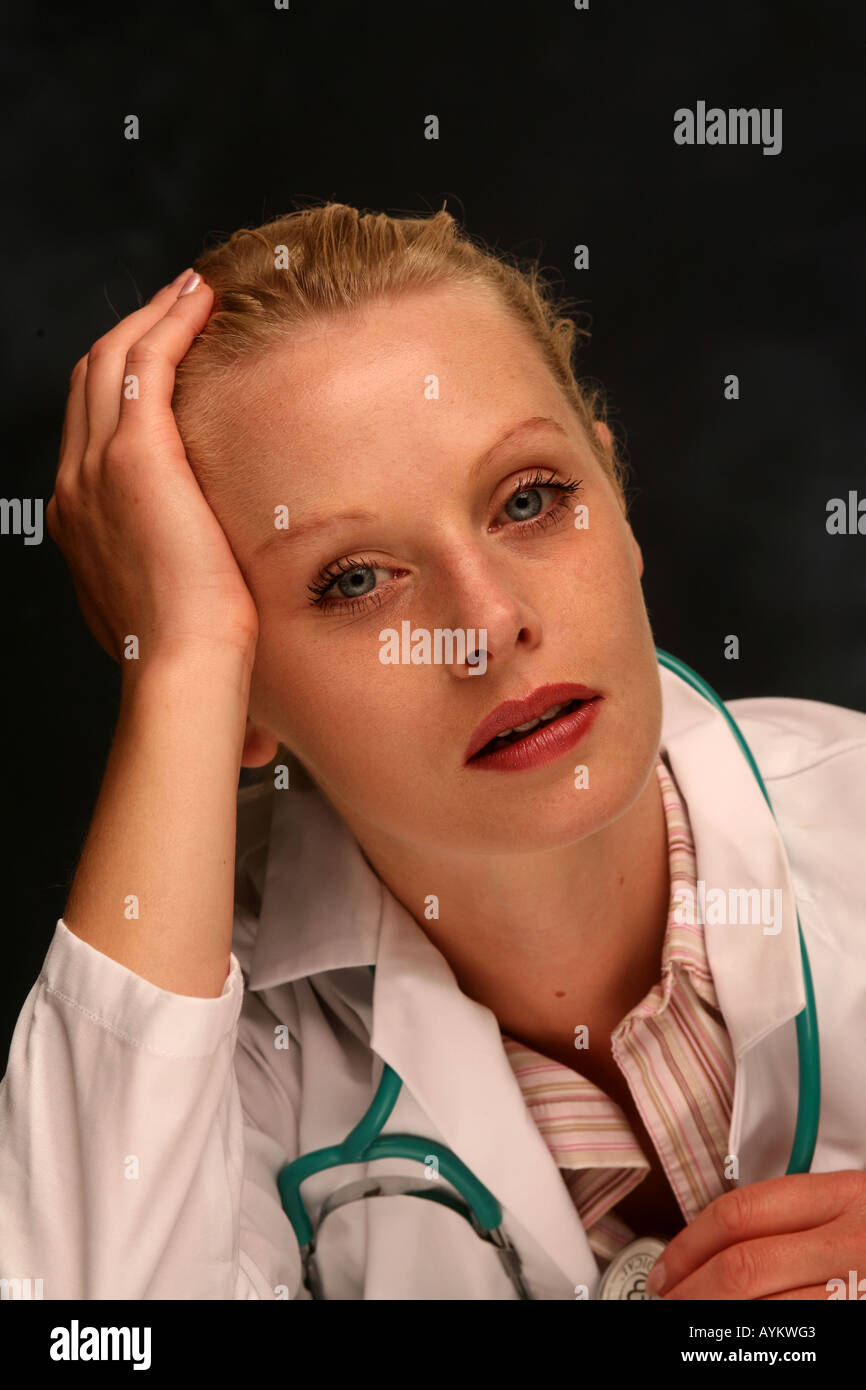 Tired young female emergency doctor hi-res stock photography and images ...