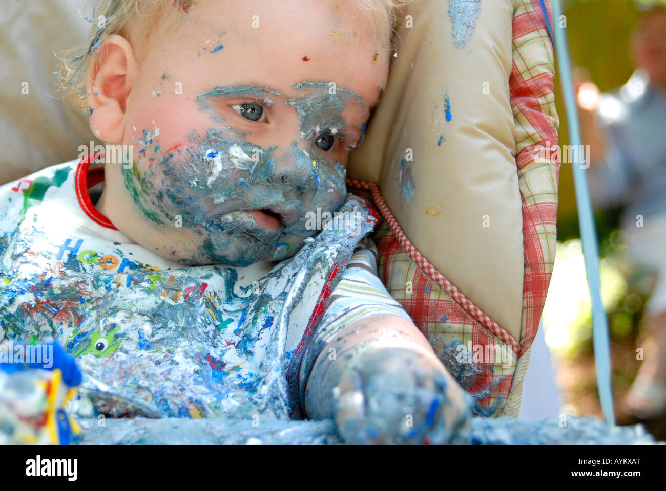 A baby after eating birthday cake Stock Photo - Alamy
