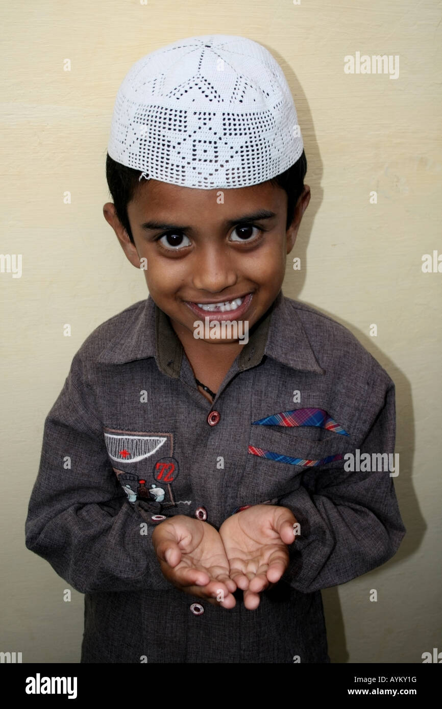 Indian Muslim boy holds out his hands in prayer , Tamil Nadu , India ...