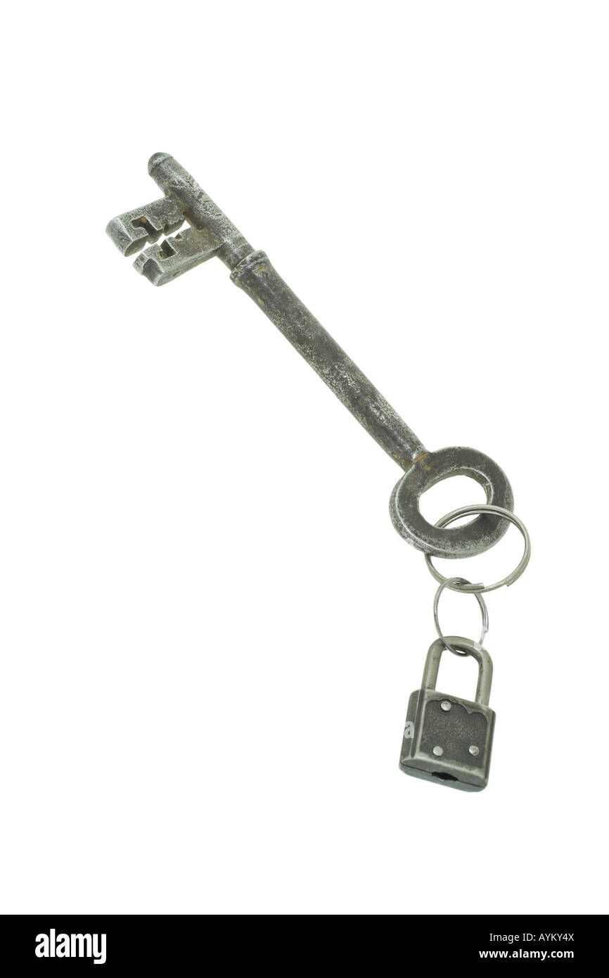 Large jumbo size antique key with old mini padlock on white background ...