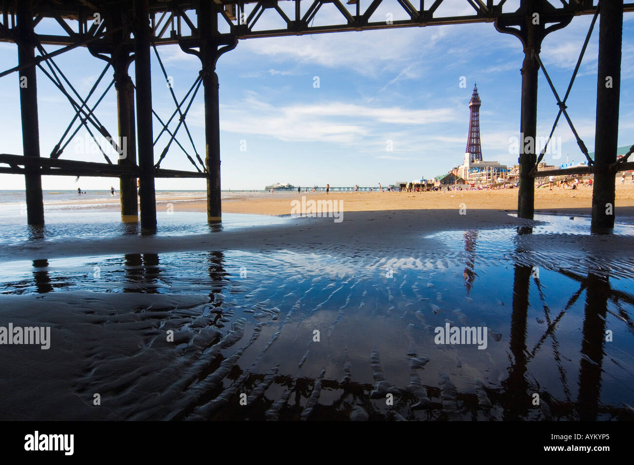 Under Central Pier Blackpool with Blackpool Tower and North Pier in the ...
