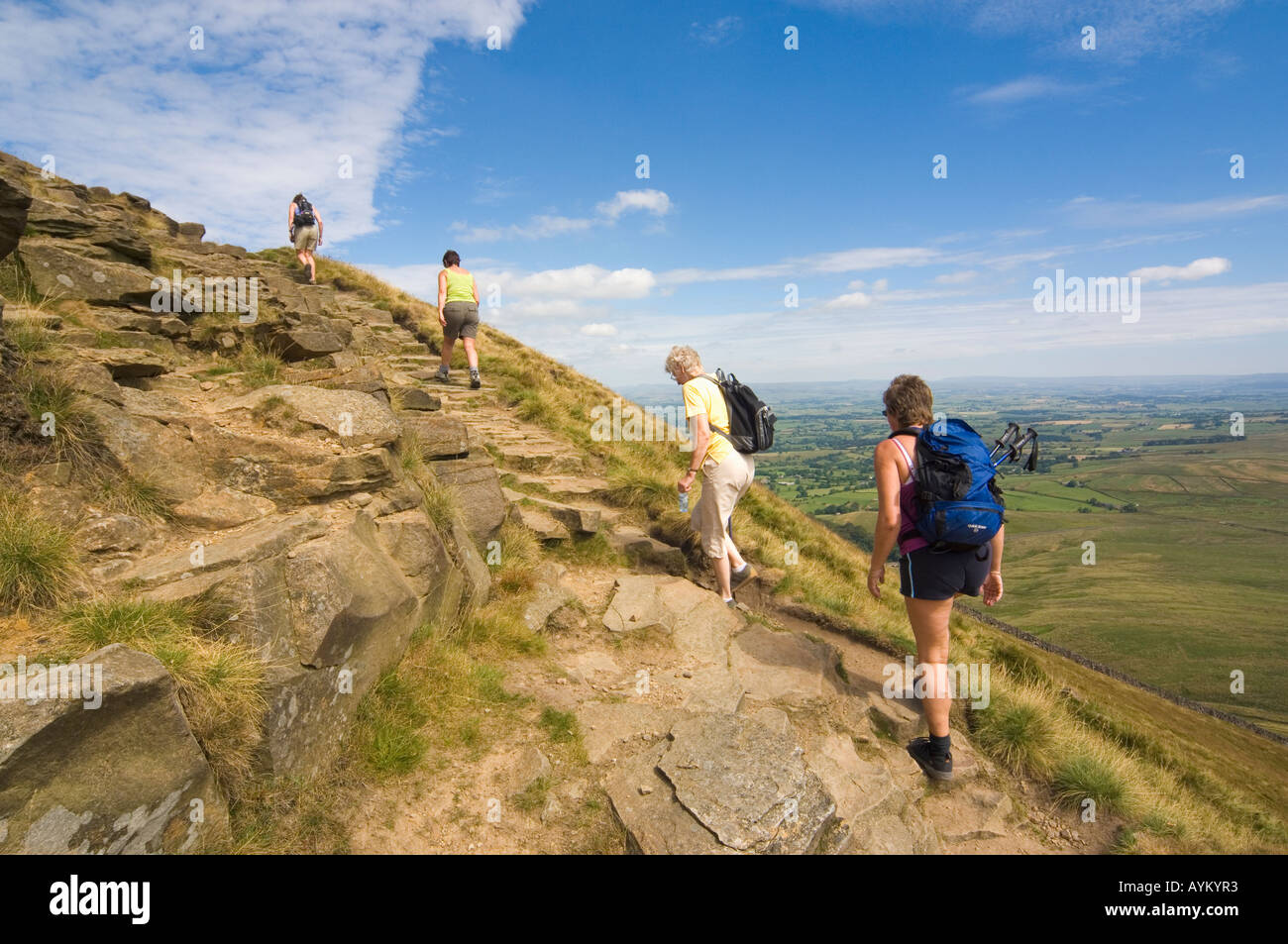 Walkers near the top of the steep path up the Big End of Pendle Hill ...