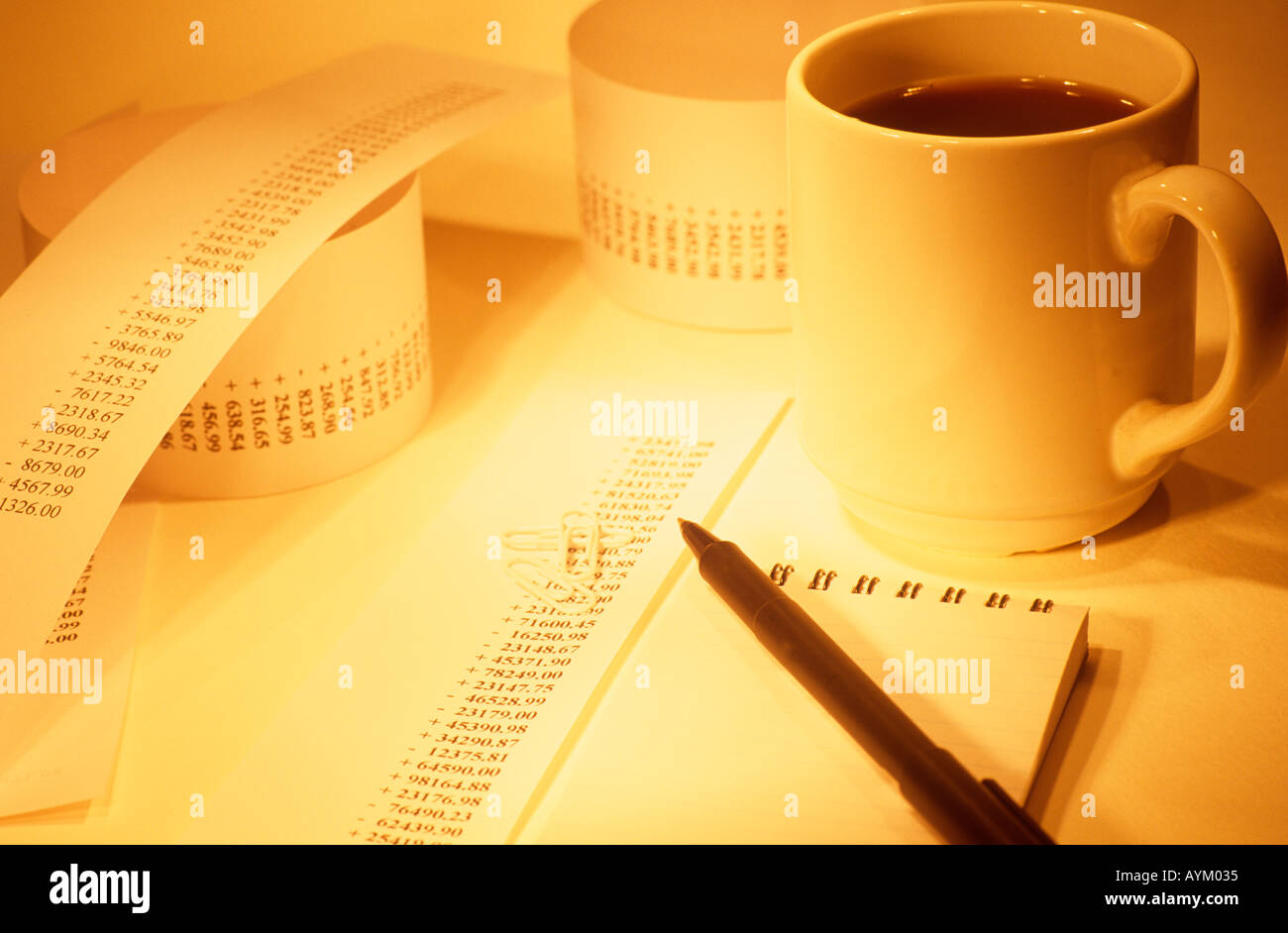 Notepad and pencil with calculations Stock Photo - Alamy