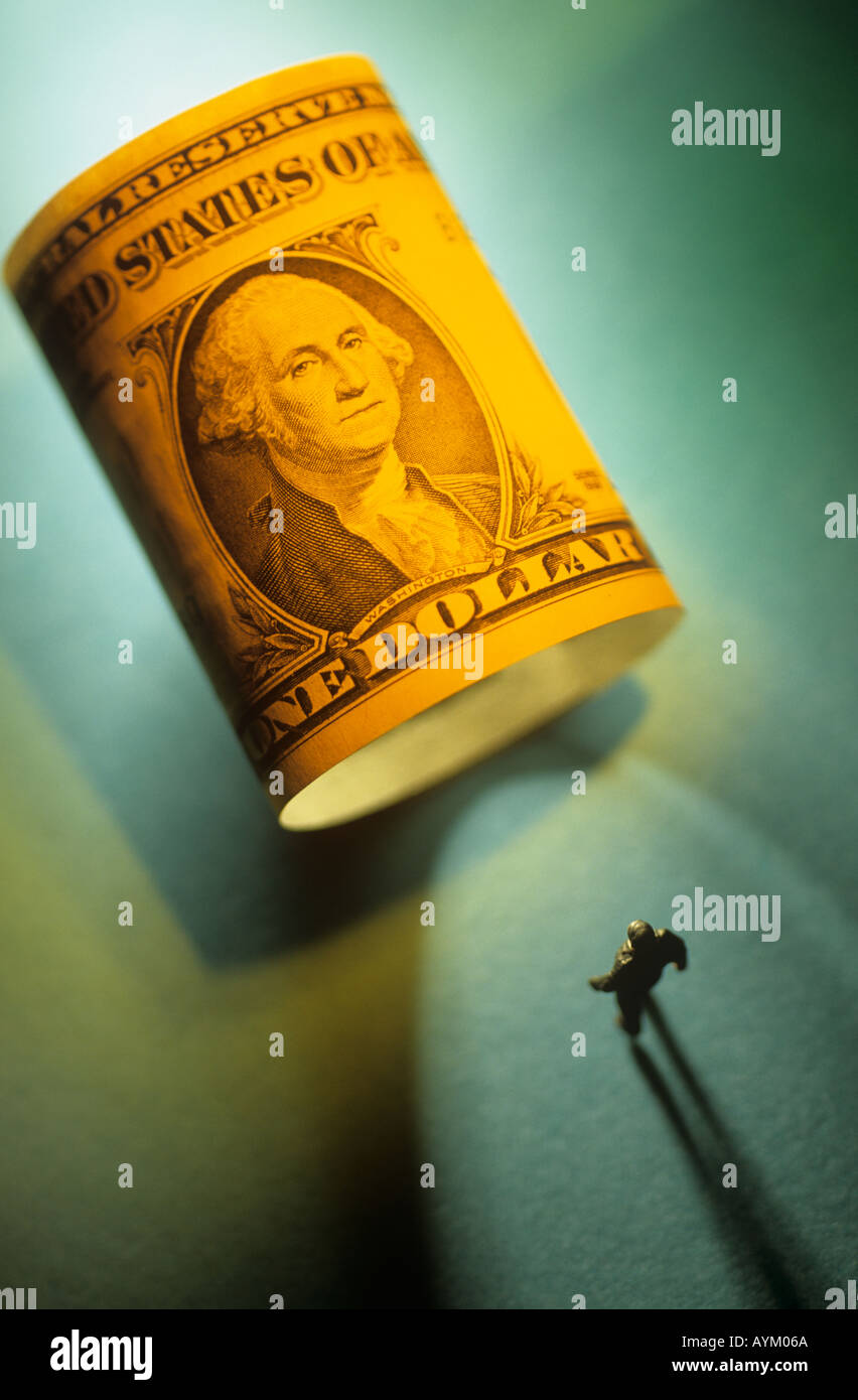Figure looking through a dollar bill Stock Photo - Alamy